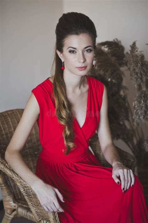 The Girl In Long Red Dress Sitting In A Chair 4911 Stock Image Image