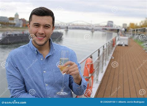 Upper Class Elegant Ethnic Man Drinking Champagne In Private Yacht