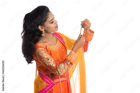 Beautiful Indian Girl Showing Rakhi On Occasion Of Raksha Bandhan