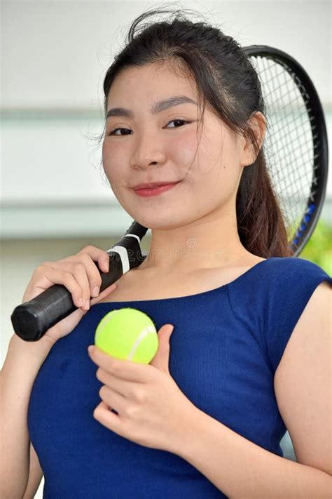 Pretty Filipina Female Basketball Player Posing With Basketball Stock
