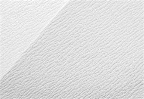 A Closeup Shot Of A White Textured Surface With Diagonal Folds Creating A Dynamic And Visually