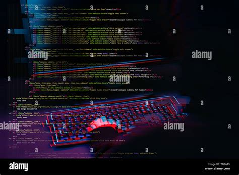Hacker Working With Computer In Dark Room With Digital Interface Around Image With Glitch