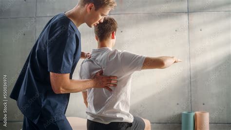 Professional Sport Physiotherapist Working On Specific Muscle Groups