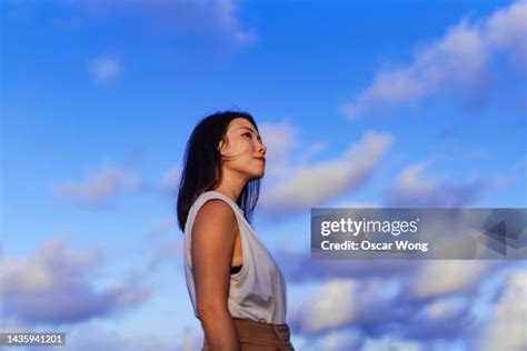 Woman Looking Up At Sky Profile