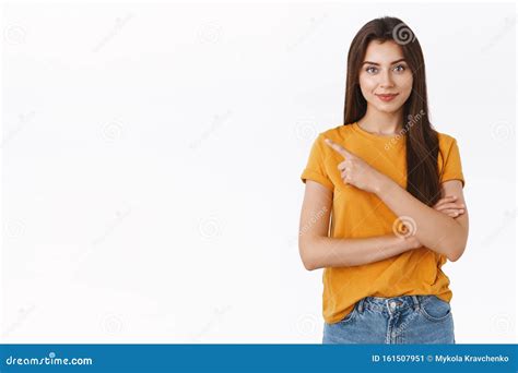 Sassy Self Assured Brunette Woman In Yellow T Shirt Smiling Determined