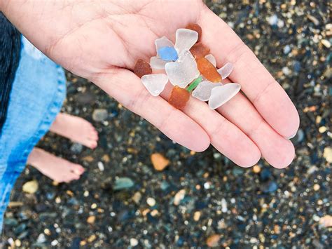 Collecting Sea Glass At The Beach By Stocksy Contributor Cara Dolan