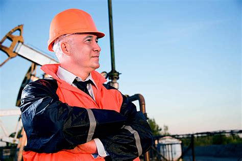Engineer In An Oil Field Safety Pipeline Industrial Photo Background
