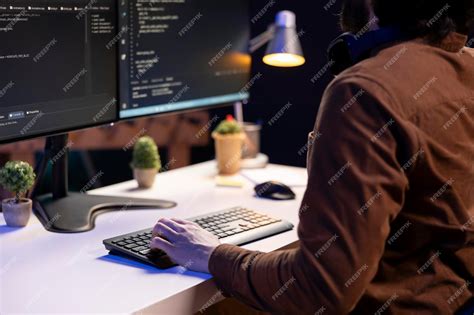Premium Photo System Administrator Doing Software Debugging On Pc At