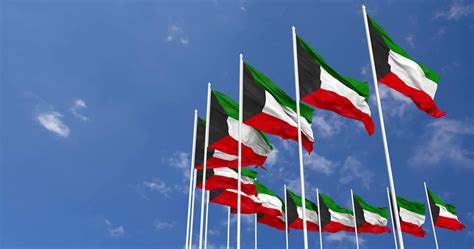 Kuwait Flags Waving In The Sky Seamless Loop In Wind Space On Left