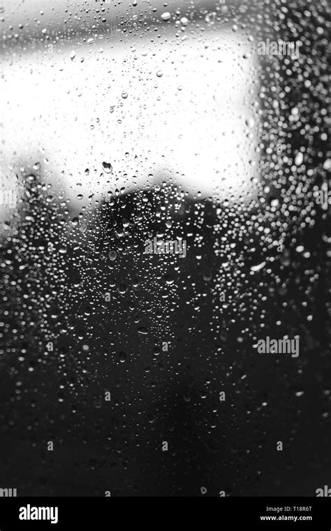 Closeup Of Condensation Patterns On Glass Window Water Droplets With