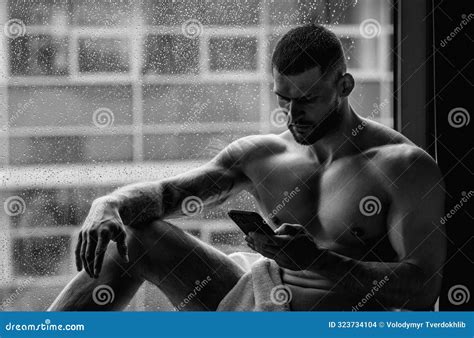 Handsome Nude Man In A Bedroom Using Phone Young Man At Night Stock