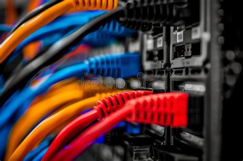 Colorful Network Cables Connected To Server Ports Showcasing Data Communication Concept Stock