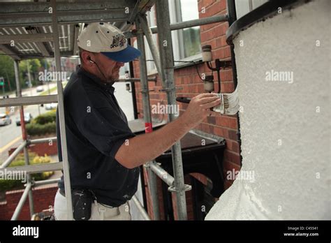 Painter And Decorator Working On A Scaffold Stock Photo Alamy