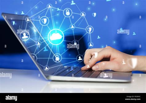 Hand Using Laptop With Centralized Cloud Computing System And Network Security Concept Stock