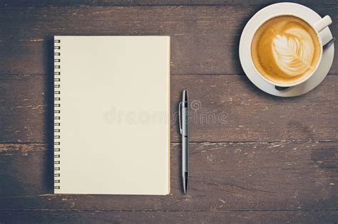 Top View Notebook Pen Coffee Cup And Phone On Wood Table Vintage