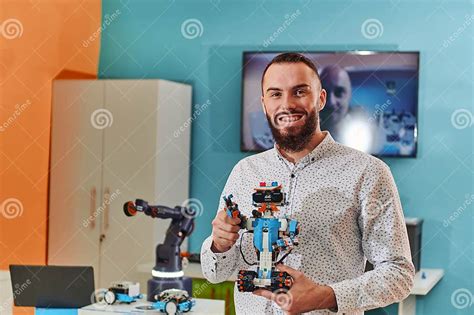 A Man Working In A Robotics Laboratory Focusing On The Intricate Fields Of Robotics And 3d