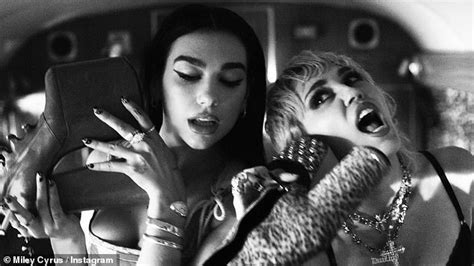 Miley Cyrus Shares Racy Snap Of Herself Teasing A Kiss With Dua Lipa