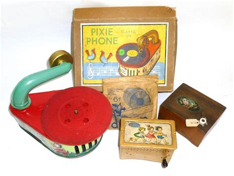 Lot 1203 A Boxed Gama Tinplate Toy Pixie Phone