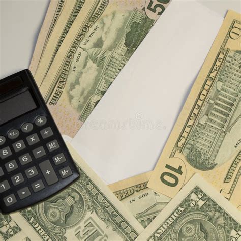 calculator on the photo of money calculate the cost of a car trip