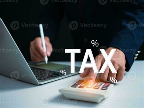Businessman Using Computer And Calculator For Tax Calculation Online Personal Tax Return Form Businessman Using Computer And Calculator For Tax Calculation Online Personal Tax Return Form