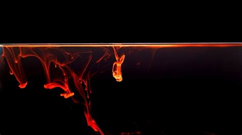 Orange Colorful Fluorescent Smoke On Black Background Art Abstract