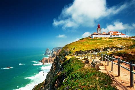 Cabo Da Roca Lighthouse On A Cliff Overlooking The Ocean In Portugal Hd