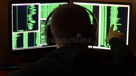 Hacker Is Looked To Binary Code Criminal Hacker Penetrating Network System Stock Footage
