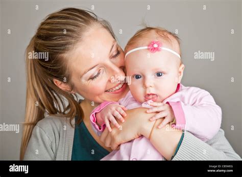 Portrait Of Mother Holding Baby Girl Stock Photo Alamy