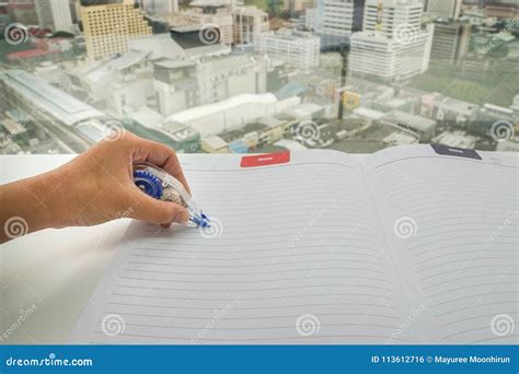 Woman Uses Fluid Correction Pen On Mock Up Paper Sheet For Mistake