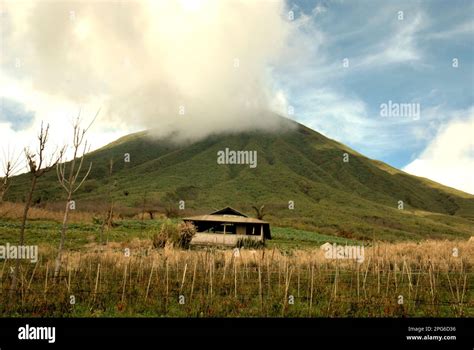 Agricultural Field And A Wooden Building On The Slope Of Mount Lokon