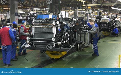 View Inside Of The Car Assembling Plant And Workers At The Production