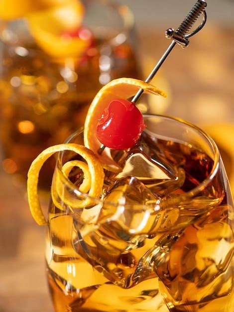 Premium Photo Old Fashioned Cocktail Served On The Rocks With Orange Peel Garnish