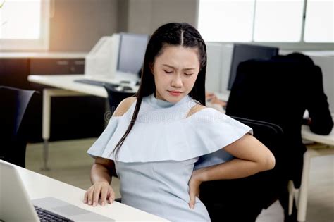 Tired Beautiful Asian Woman Officer Relieve Physical Tension During