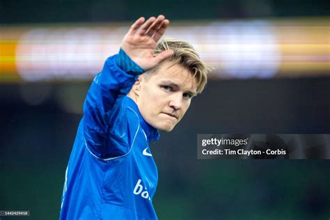 Martin Ødegaard Of Norway Waves To Young Fans During Team Warm Up