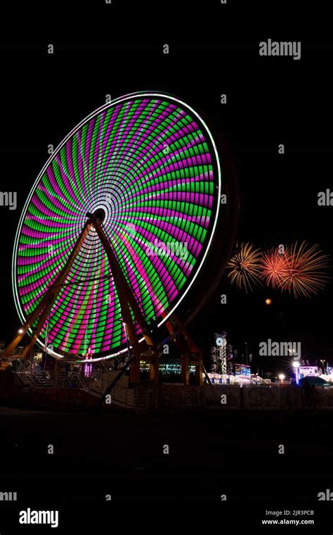 Fireworks And Lights On A Spinning Ferris Wheel At Night Delaware