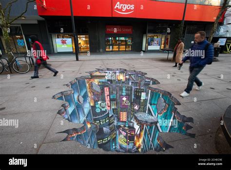 Editorial Use Only Passers By Look At A Piece Of 3d Street Art Is