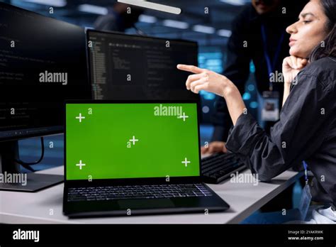 Software Developer Works On Green Screen Laptop In Data Center Housing Storage Gear Worker