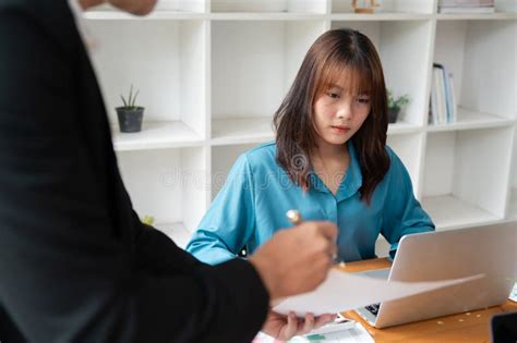 Young Professional Woman Working On Laptop In Modern Office With