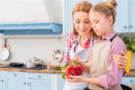 Free Photo Close Up Of Woman And Her Daughter Sitting In The Kitchen