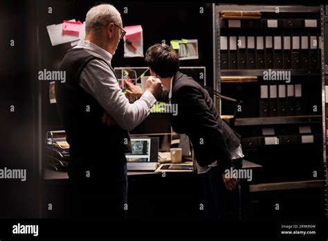 Private Detectives Working Overhours At Crime Report In Federal Bureau Discussing Criminal