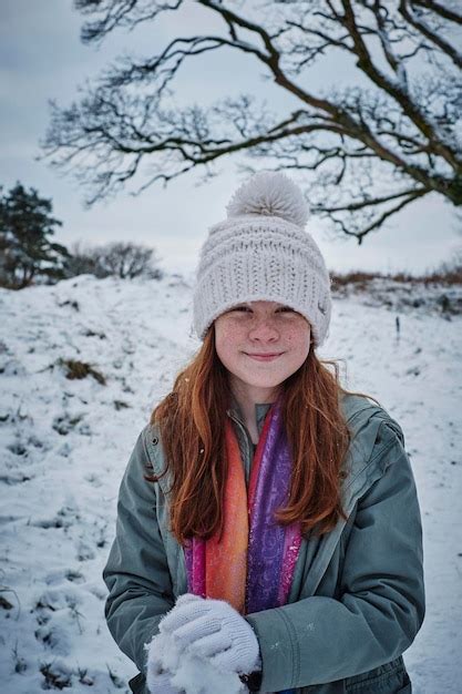 Premium Photo Portrait Of Smiling Girl In Snow Field