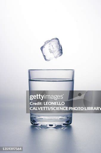 Ice Cube Falling Into Glass Of Water Illustration High Res Vector