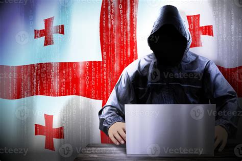 Anonymous Hooded Hacker And Flag Of Georgia Binary Code Cyber Attack