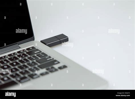 A 16gb Black Usb Stick Plugged On Right Side Of Laptop Closeup Shot With Focus On Keyboard And