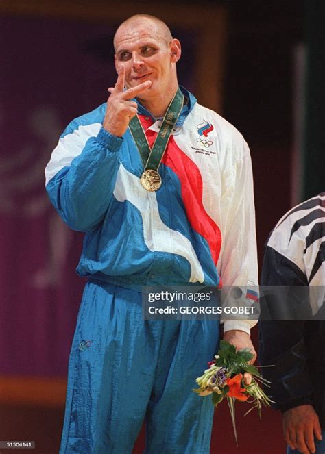 Russian Wrestler Alexander Karelin Shows Three Fingers After Winning