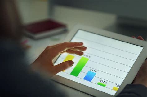 Premium Photo Female Hand Holding Tablet With Business Diagram