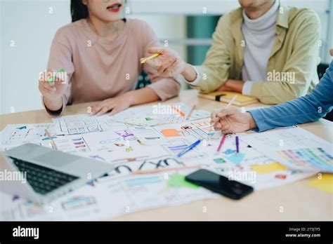 Group Of Asian Creative Team Programing Designers Participate In All Phases Of The Ux Ui Design