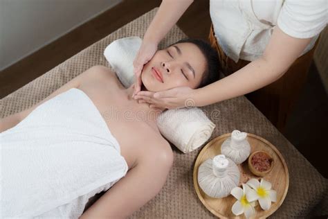 Young Woman Doing Relaxing Massage In Spa Salon Female Being Massaged