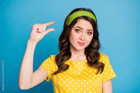 Photo Of Frustrated Girl Show Little Object Empty Space Size With Hands