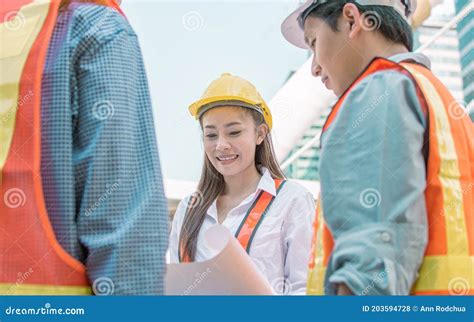 Focus On Female Engineer Looking At Paper For Project Planning Stock Photo Image Of Occupation
